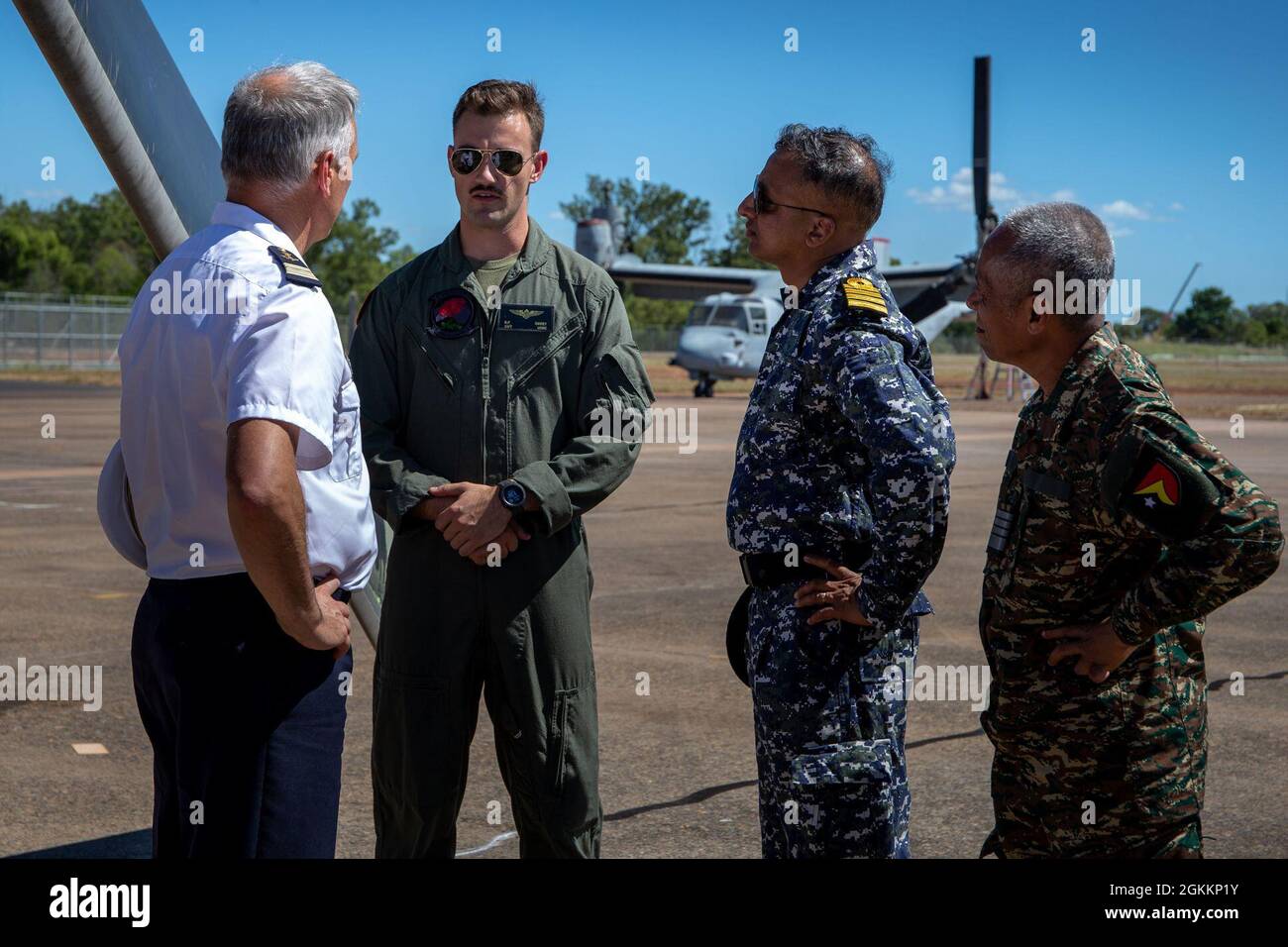 U.S. Marine Corps Capt. Ryan Garvey, center, a UH-1Y pilot, with Marine ...