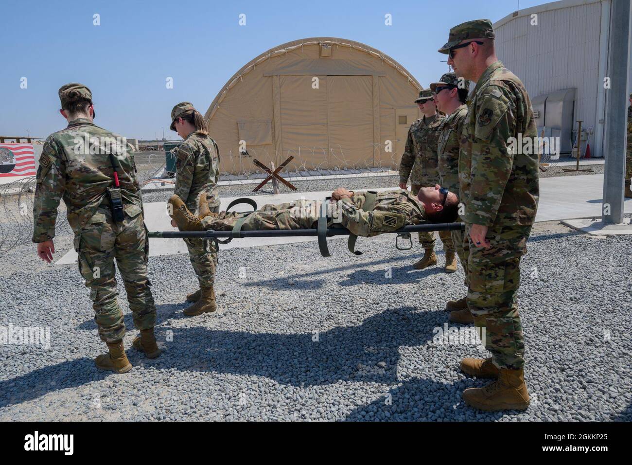 U.S. Air Force and Army medics perform a four-man litter carry as part ...