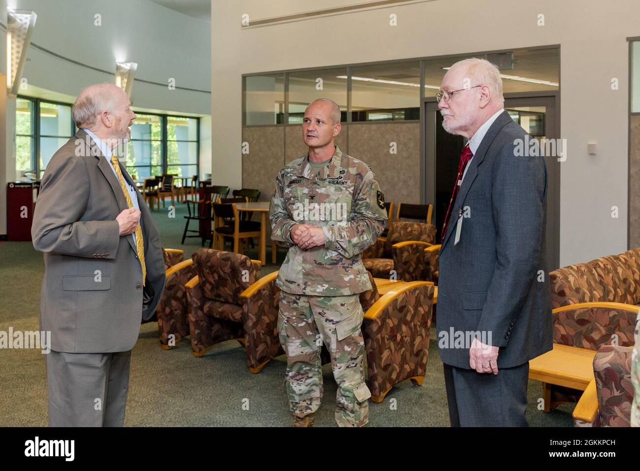 Retired Col. Charles McQueen (left), Col. Clinton Murray (center) and ...