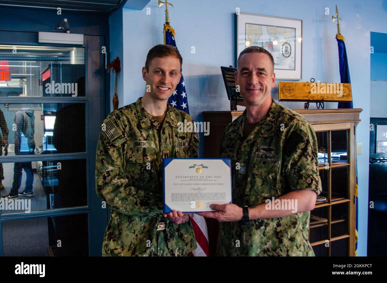 Lt. Benjamin D. Smith is presented the Navy and Marine Corps ...