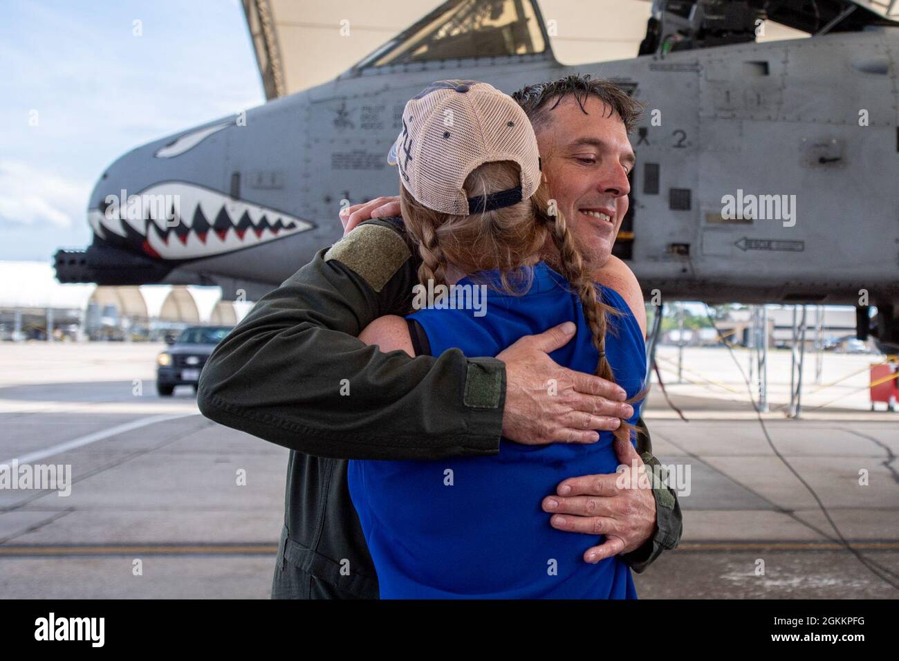 U.S. Air Force Col. Dan Walls, 23d Wing commander, embraces his wife at ...