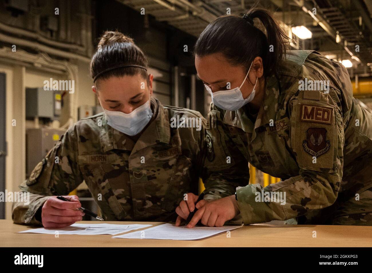 U.S. Air Force Staff Sgt. Hannah Horn and Tech. Sgt. Kelsey Pasinato ...