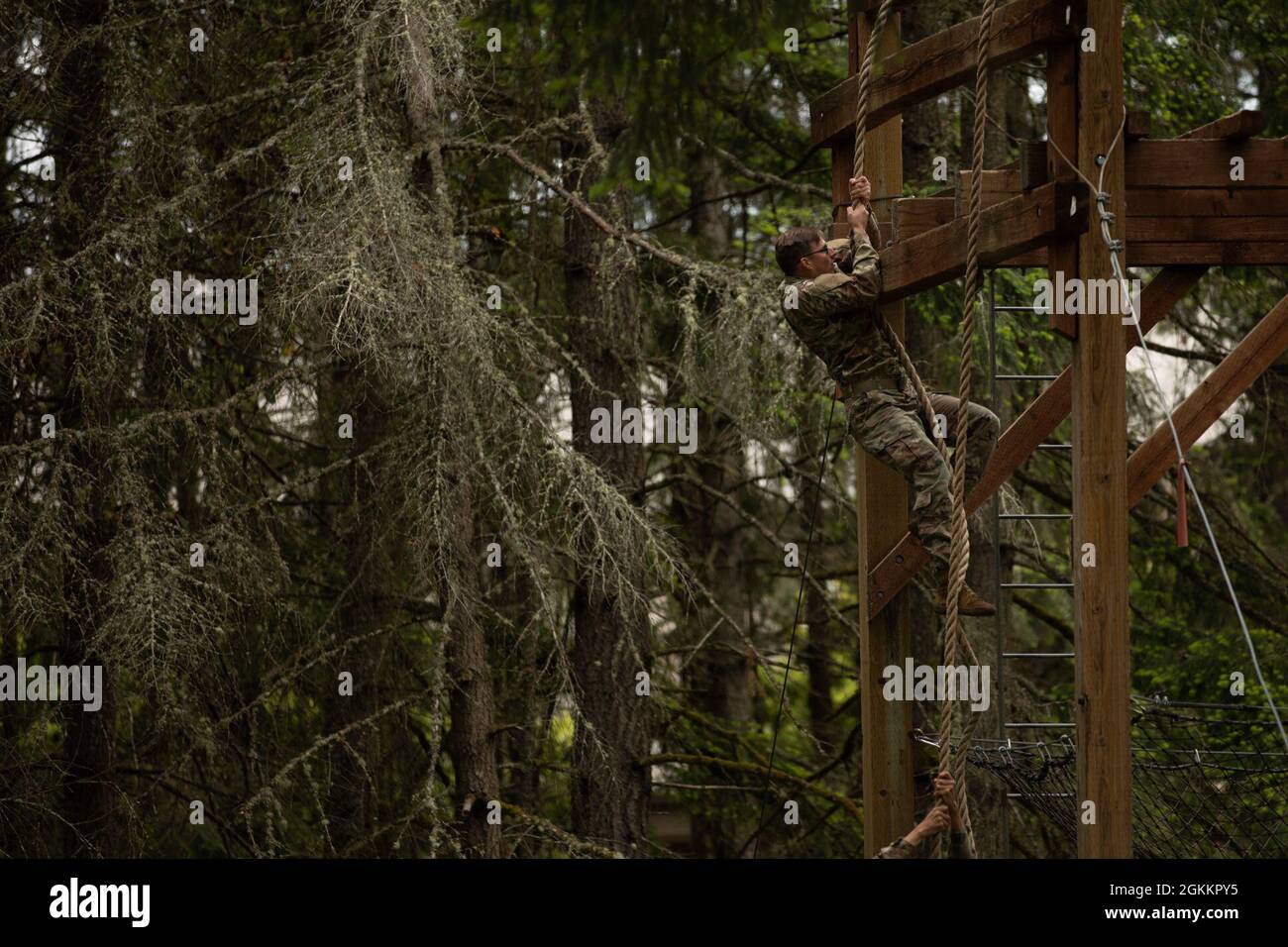 A U.S. Army Soldier from 1st Special Forces Group (Airborne) climbs a ...