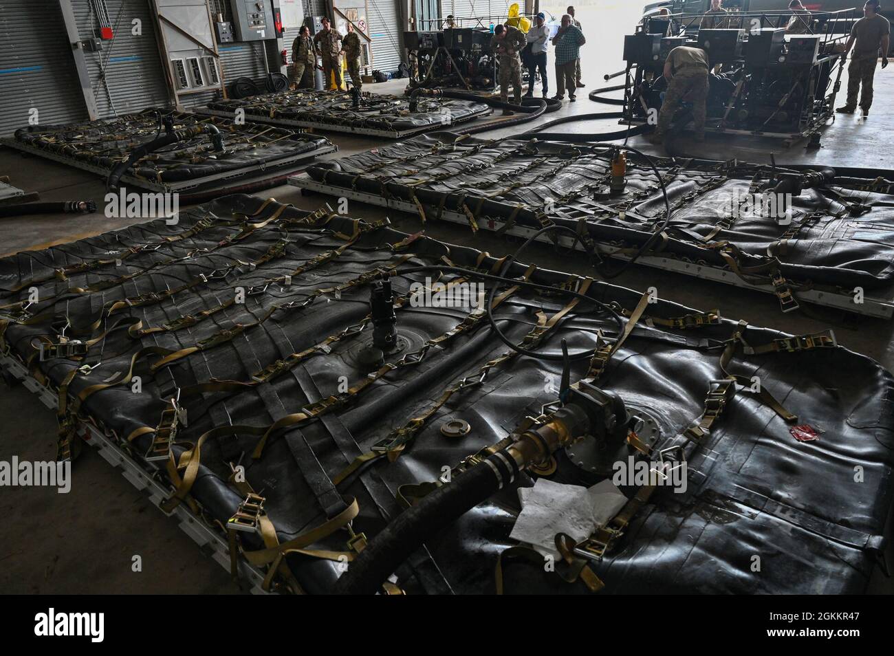 Airmen prepare to fill an Aerial Bulk Fuel Delivery System at Alpena ...
