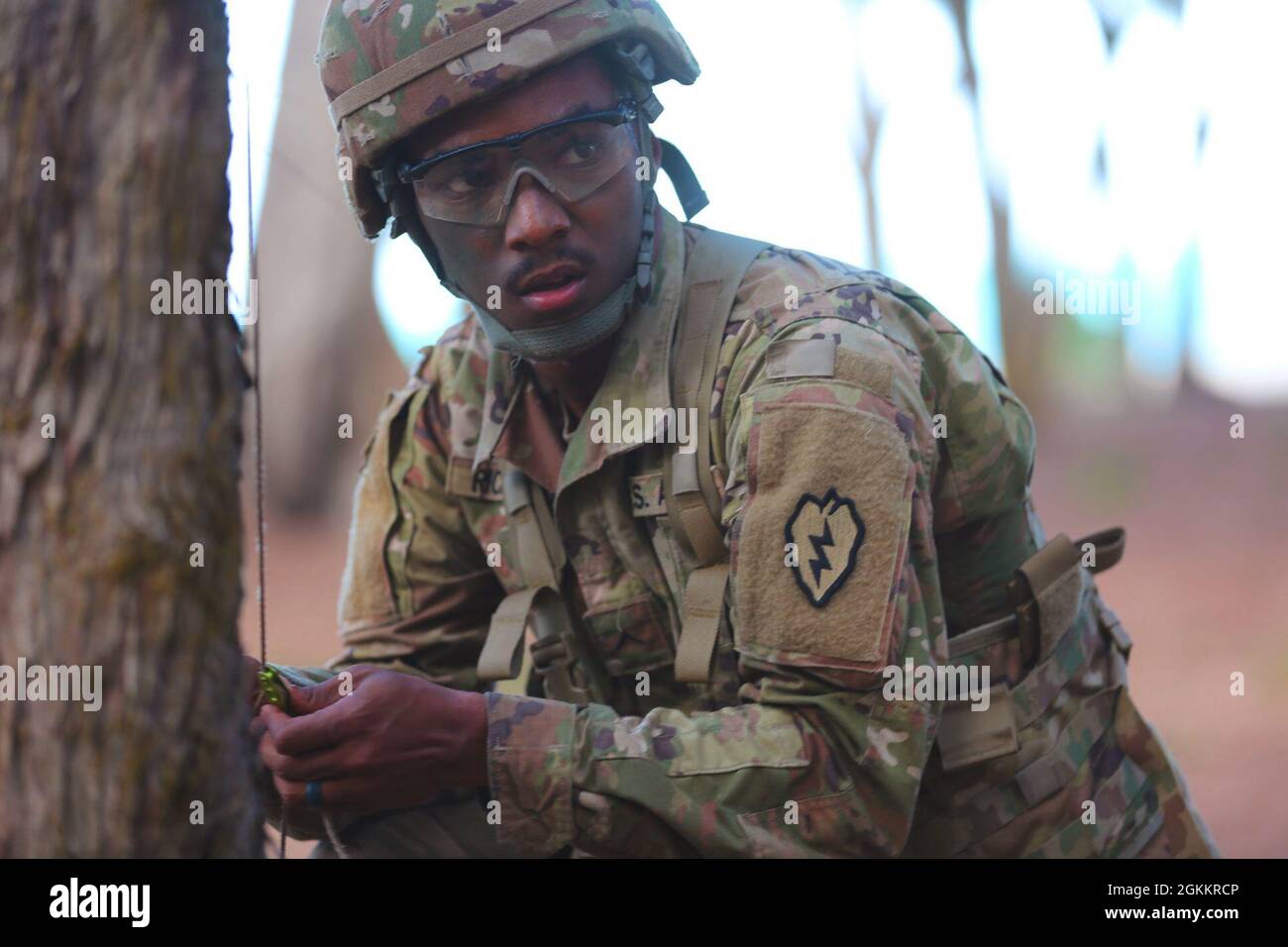 A Soldier secures a lanyard of an OE-254 during the 25th Combat ...
