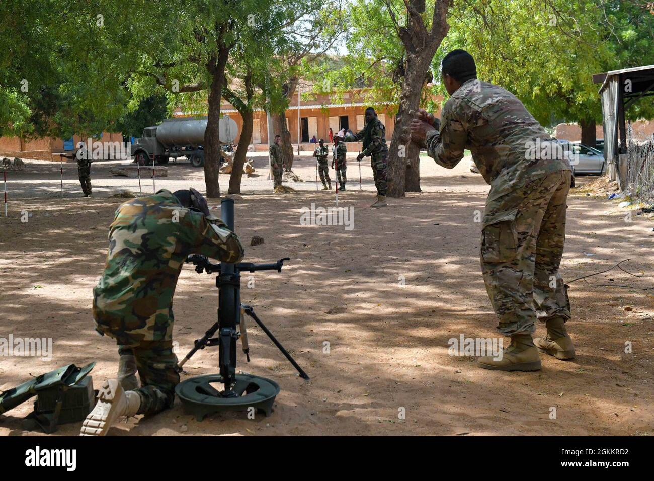 U.S. Army Sgt. 1st Class Ben Simon (right) assigned to Headquarters and ...