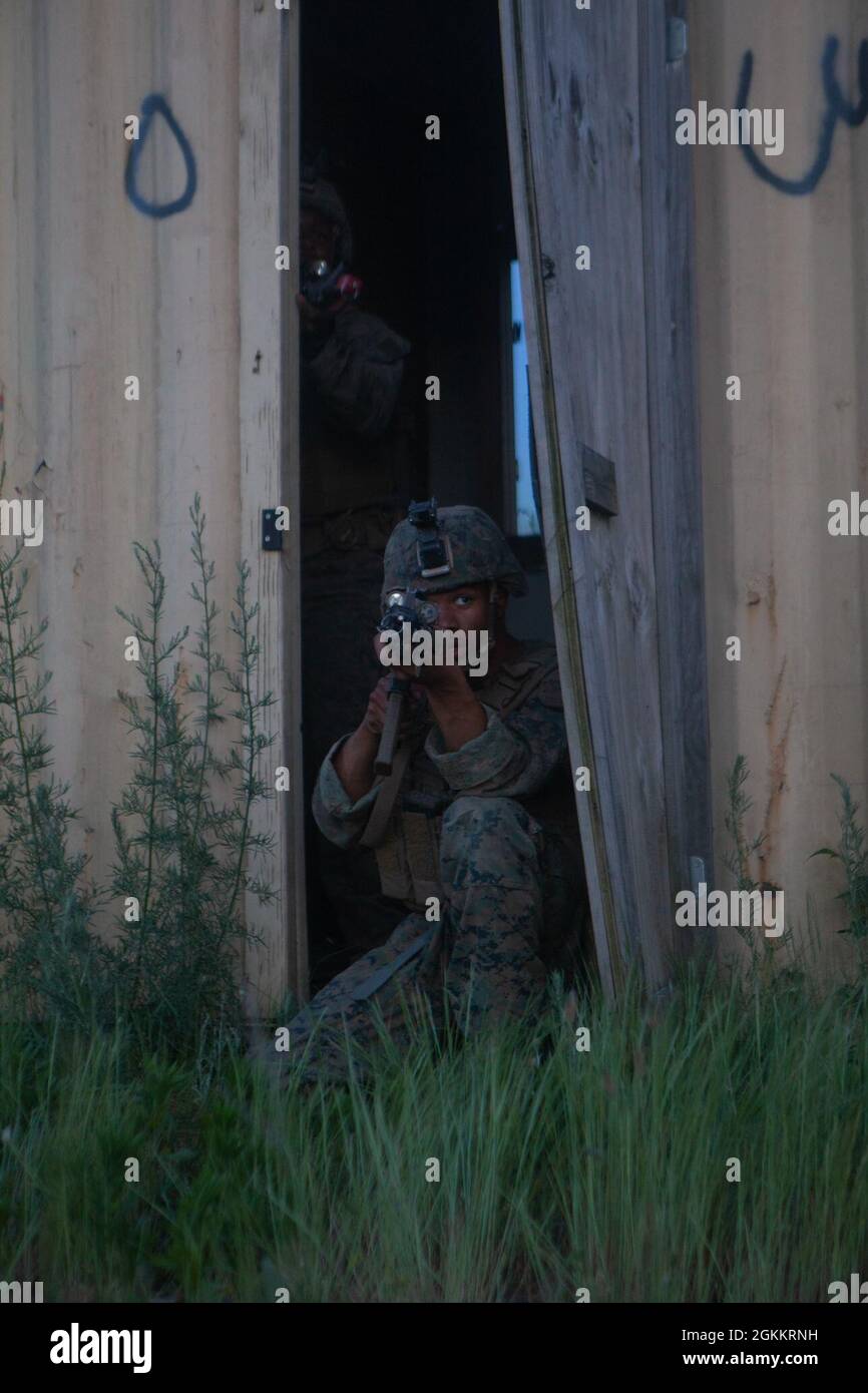 U.S. Marine Corps Lance Cpl. Taere Leslie and Lance Cpl. Corey Lewis ...