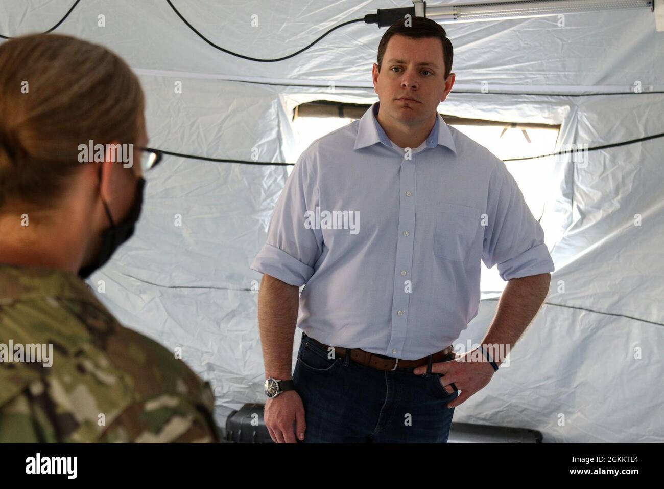 Wisconsin state Sen. Patrick Testin listens as Army Reserve Sgt. Wendy ...