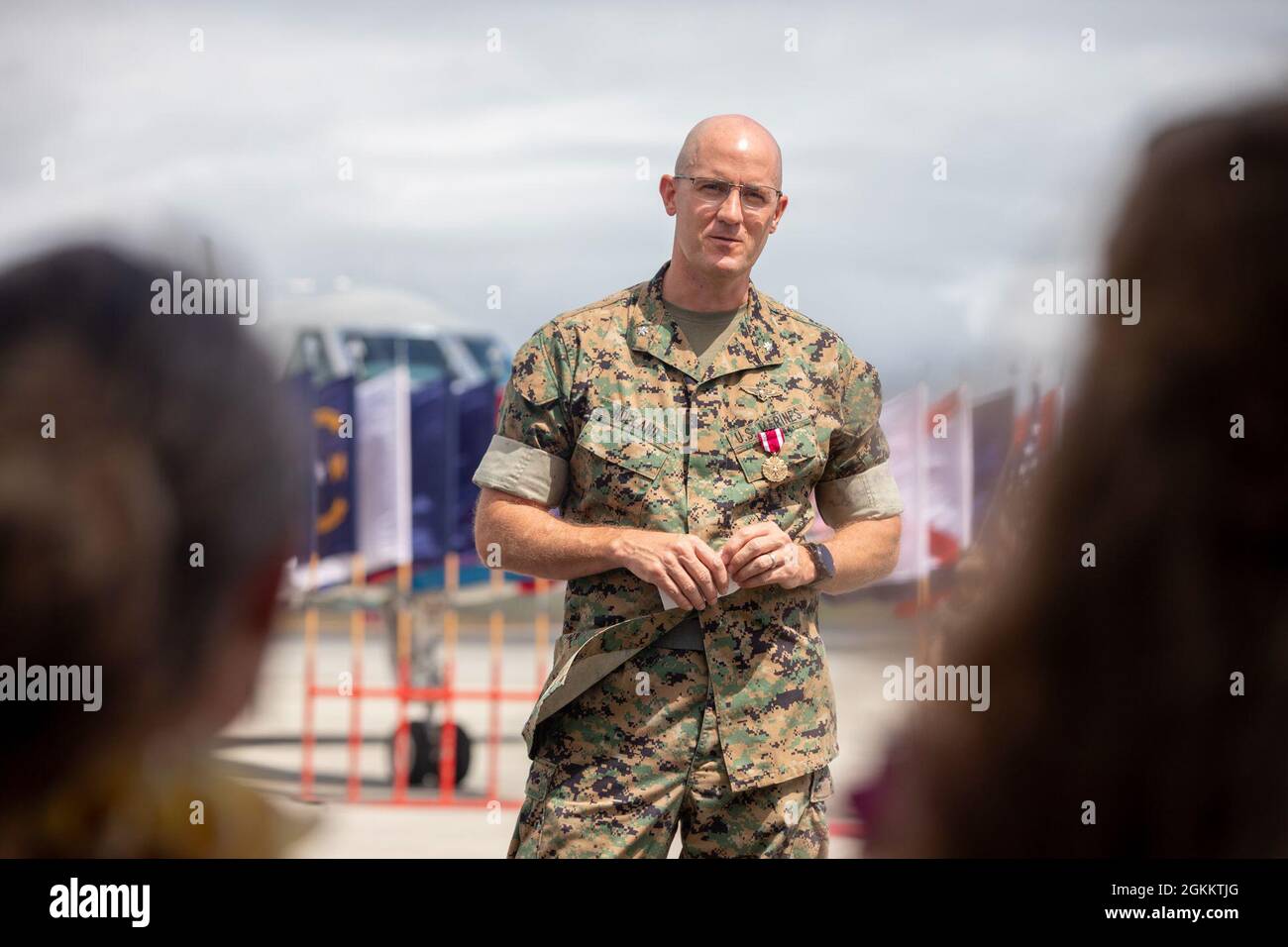 U.S. Marine Corps Lt. Col. Tyler Holland addresses his family during ...