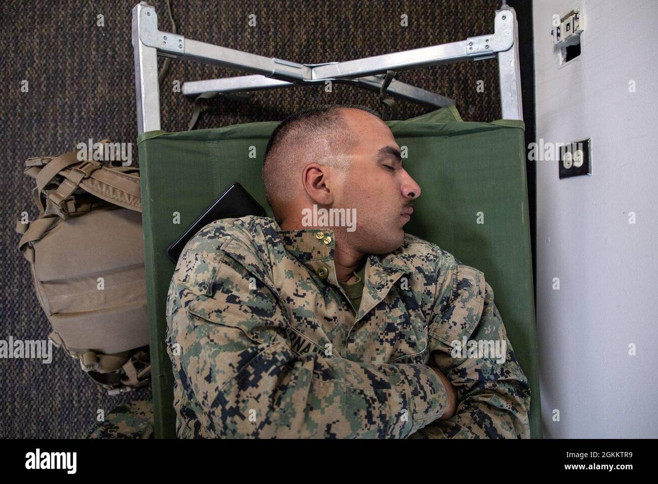 U.S. Marine Corps Lance Cpl. D'kota Hernandez, a radio operator, rests ...