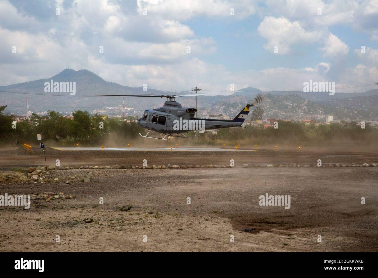 A Honduran UH-1H Huey lands on a helicopter landing zone in Tegucigalpa ...
