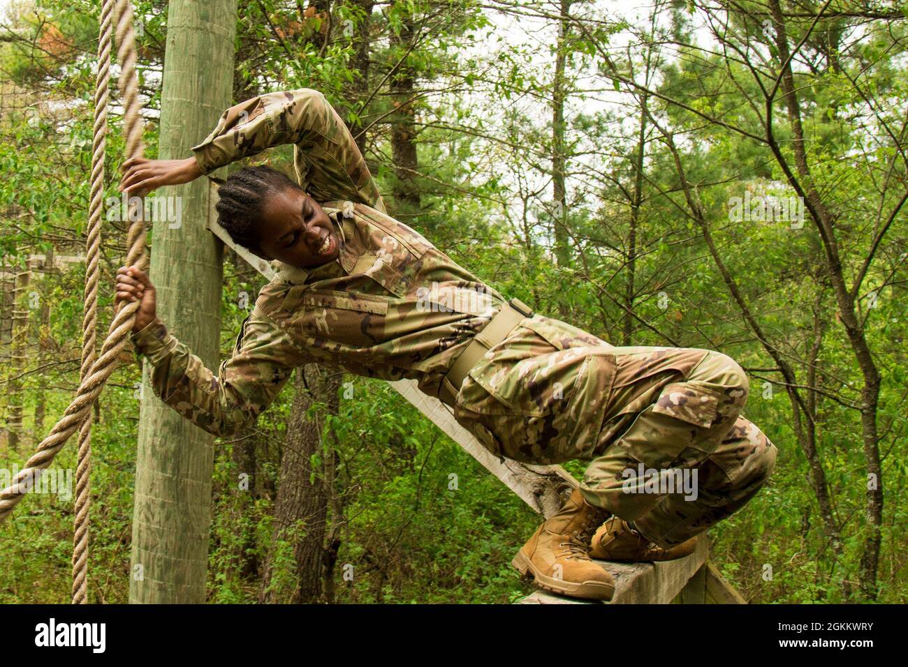 A U.S. Army Reserve Soldier successfully lands after a rope swing at ...