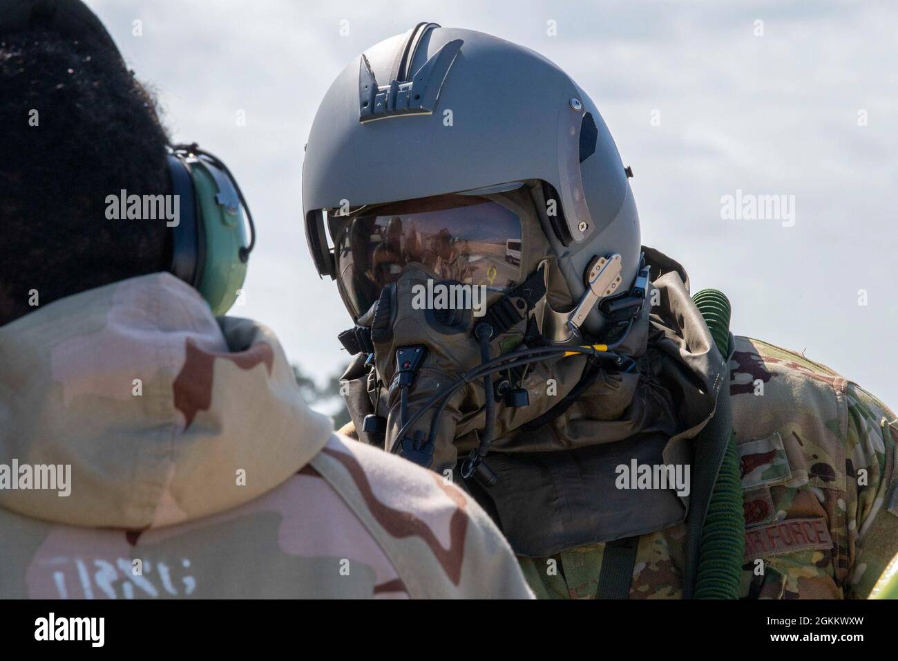 A Pilot with the 91st Air Refueling Squadron (ARS) (right), speaks to a ...