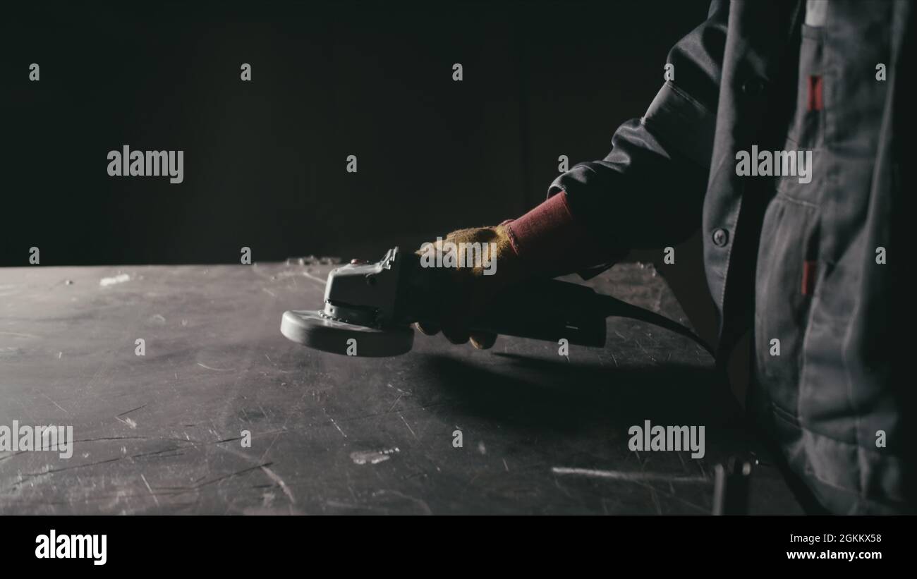 Forge workshop. Smithy manual production. Industrial worker using angle ...