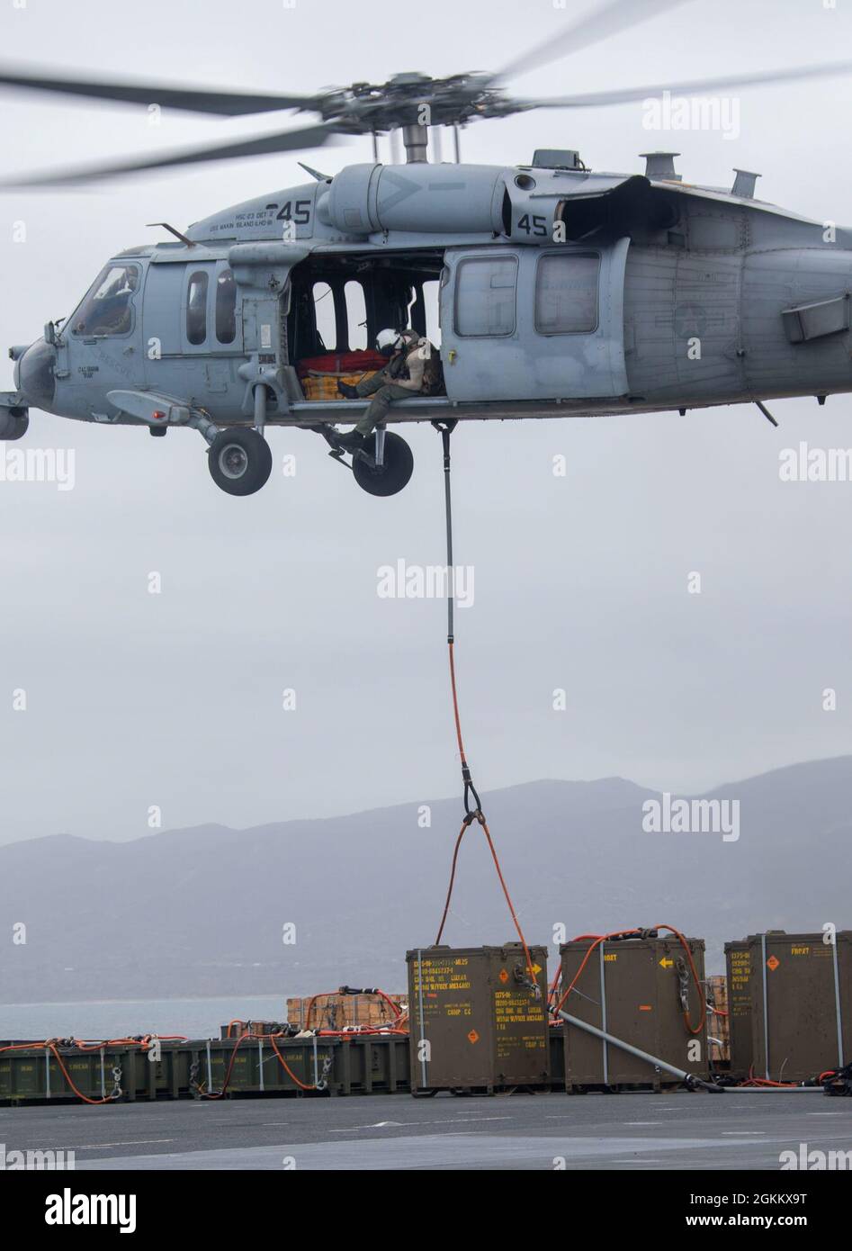 PACIFIC OCEAN (May 20, 2021) – A U.S. Navy MH-60S Sea Hawk, assigned to ...