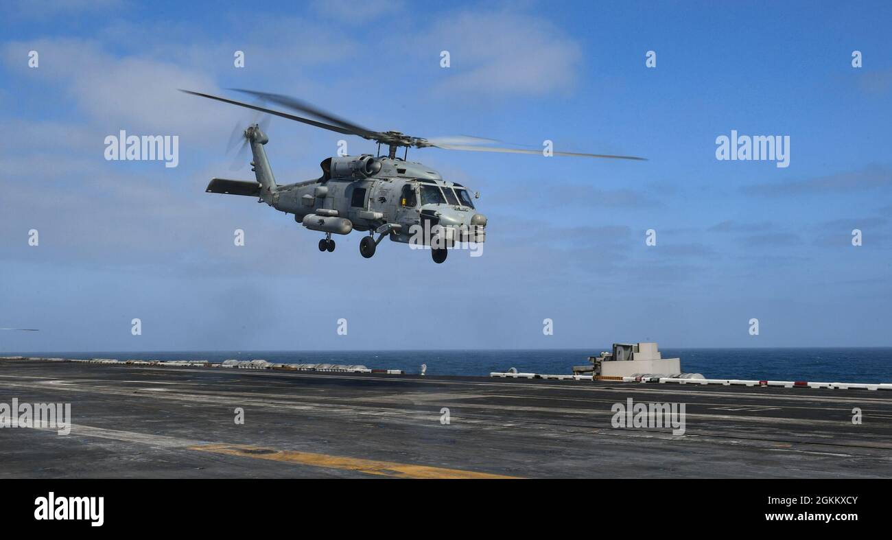 PACIFIC OCEAN (May 20, 2021) – An MH-60R Sea Hawk, assigned to the ...