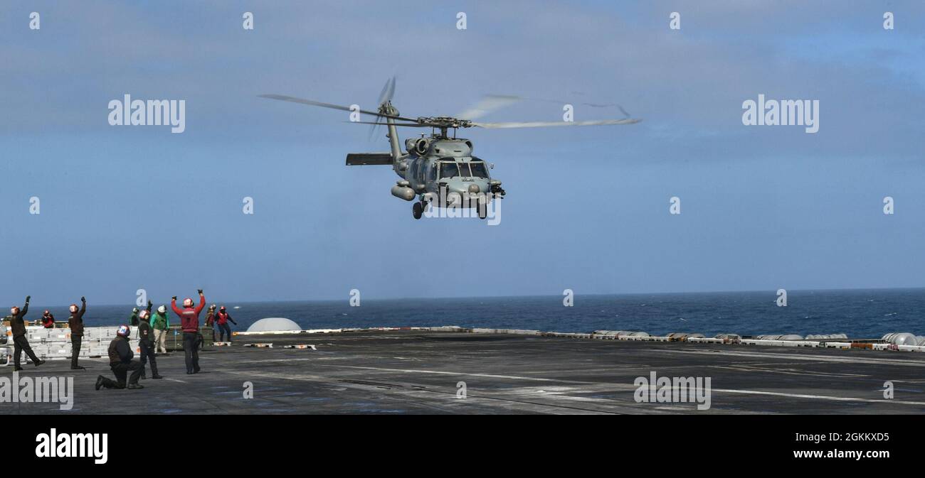 PACIFIC OCEAN (May 20, 2021) – An MH-60R Sea Hawk, assigned to the ...