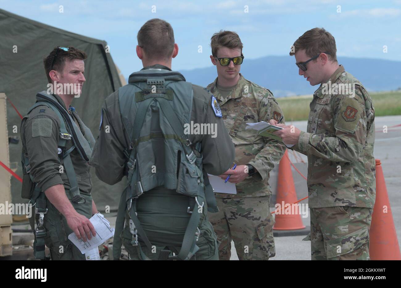 U.S. Air Force Senior Airmen Robert Sawyer (third from left) and Aaron ...