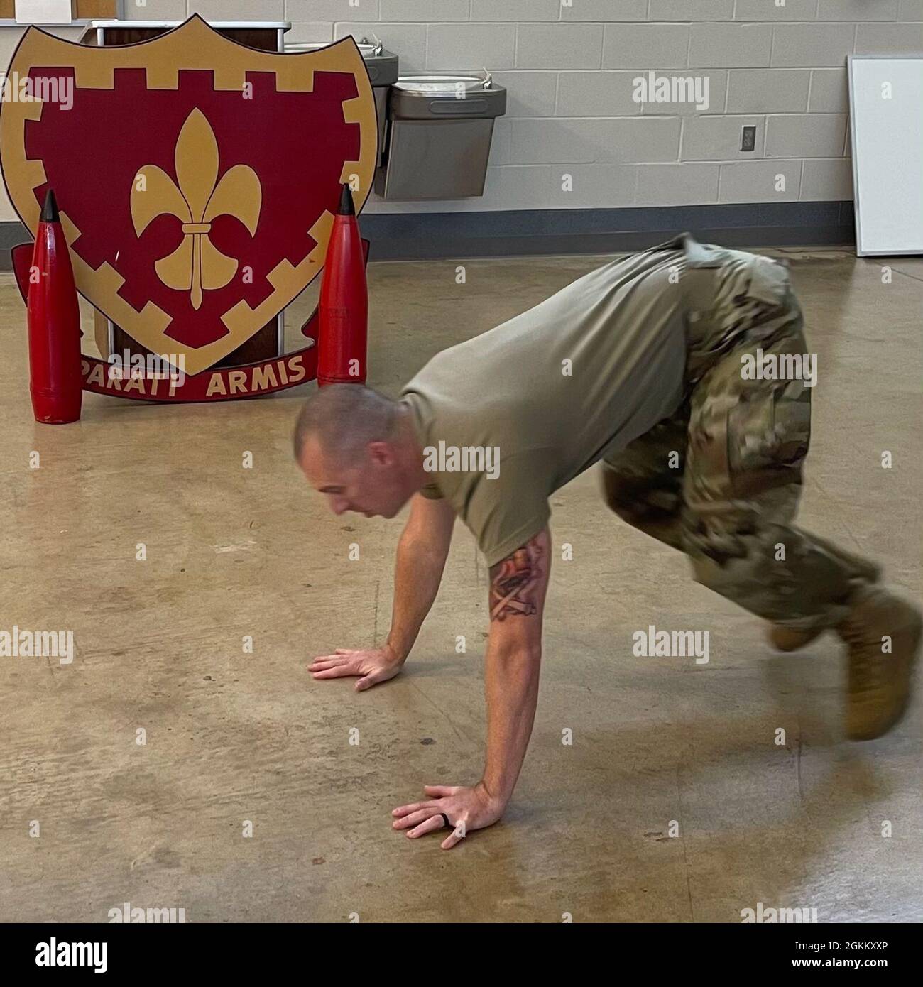 Sgt. 1st Class Joseph Garland does burpees in the 1-117th Field ...
