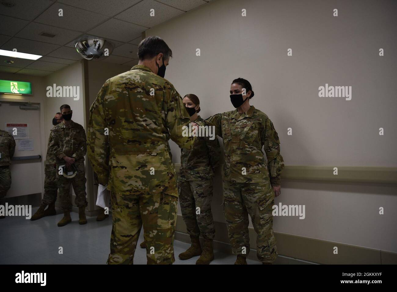 U.S. Air Force Lt. Gen. Kevin Schneider, 5th Air Force commander, coins ...