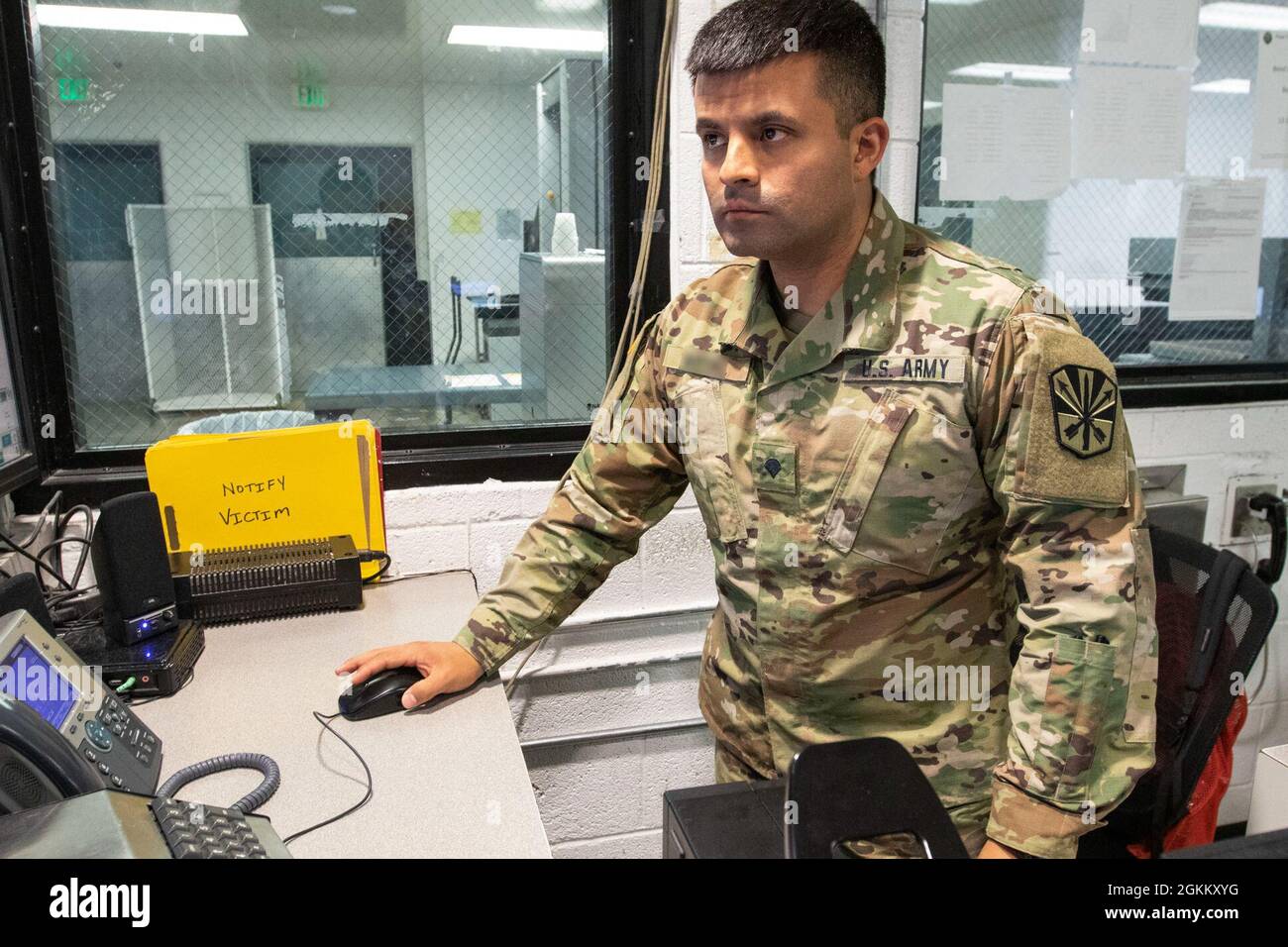 An Arizona Guardsmen checks maintains door security and surveillance at ...