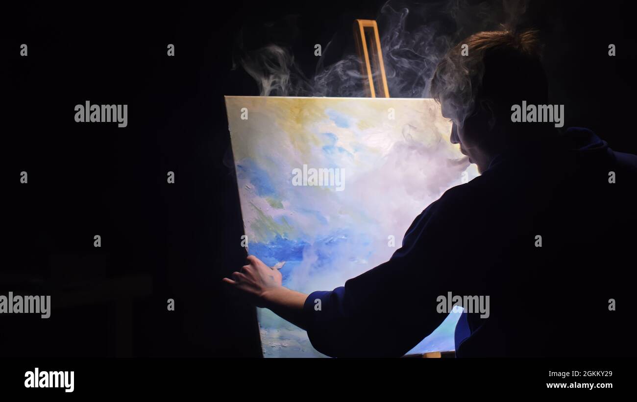 Artist copyist paint seascape with ship in ocean. Vaper smoke vape e ...