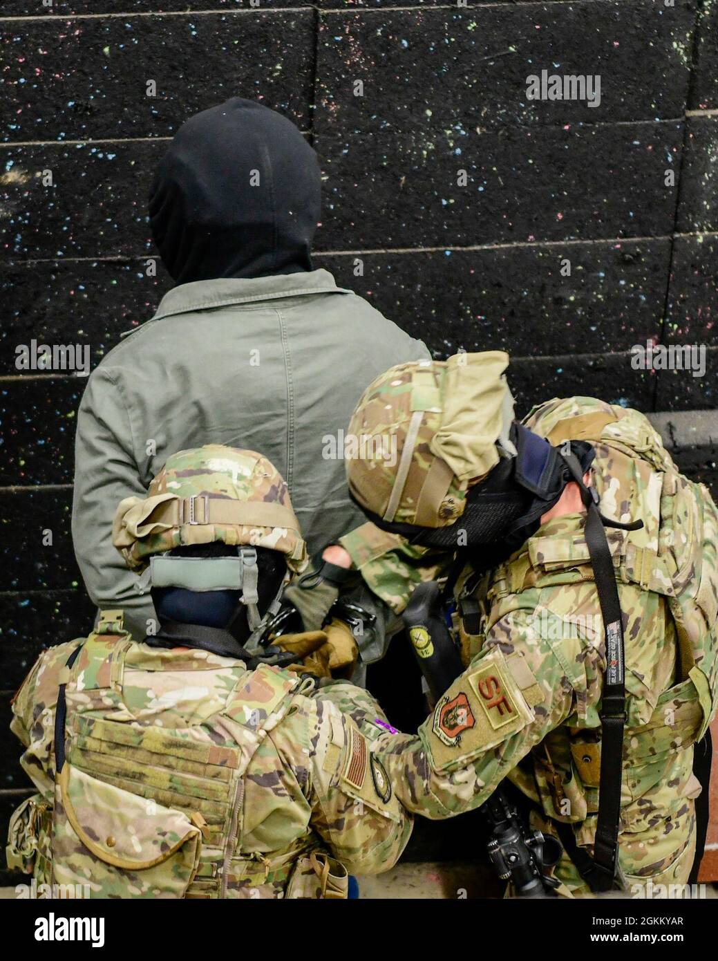 Air Force Reserve Command security forces Airmen handcuff an opposing ...