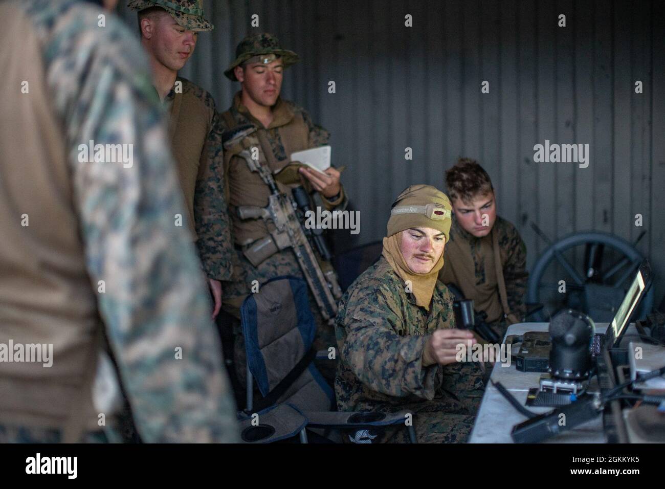 U.S. Marine Corps Staff Sgt. Matthew Pitman, second from right, the ...