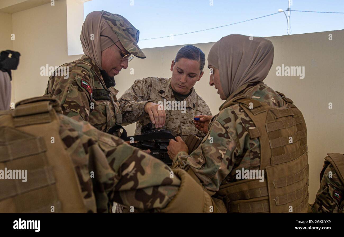 A U.S. Marine Corps Female Engagement Team (FET) member, assigned to ...