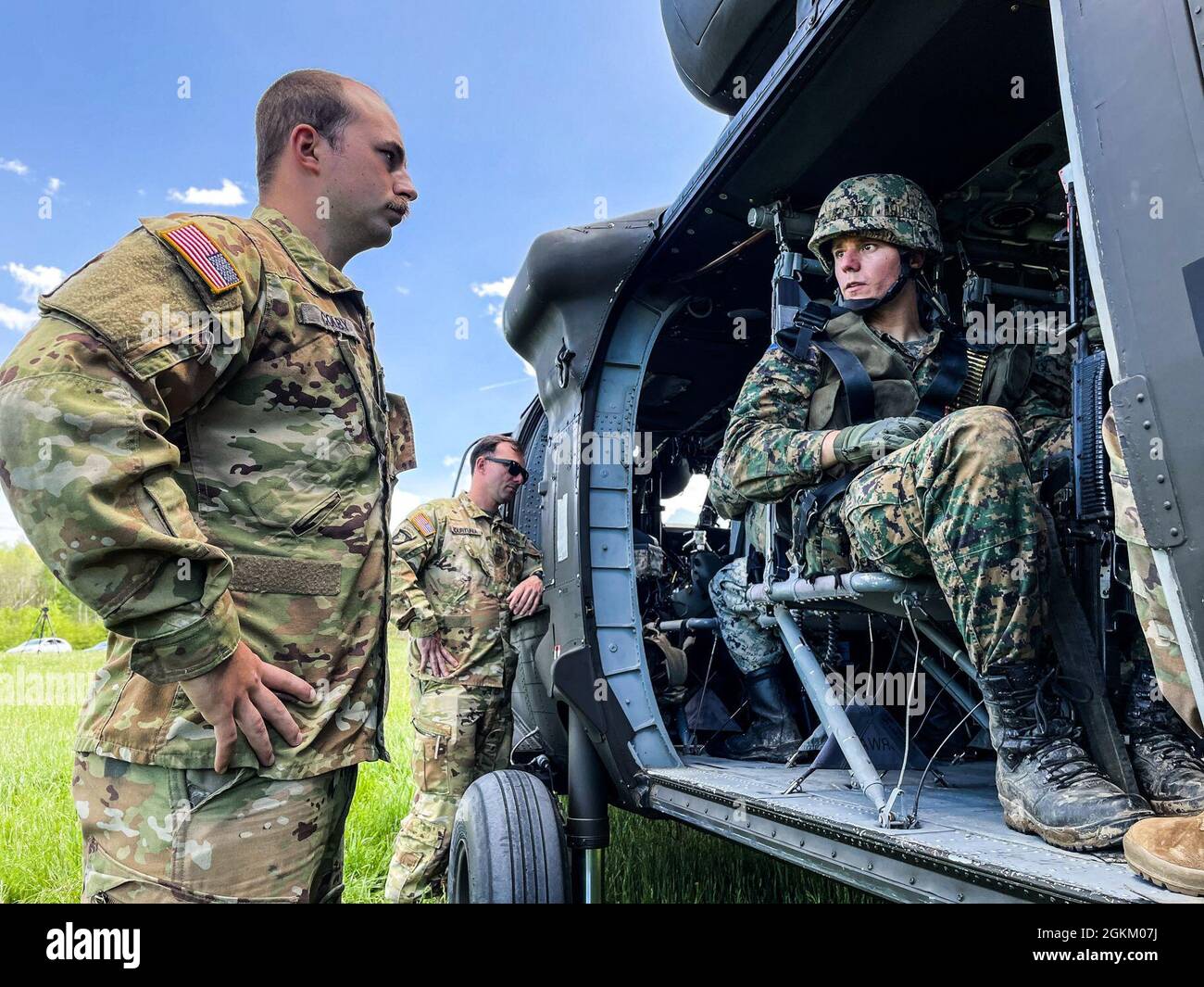U.S. Army Spc. Michael Colby (left), a UH-60 helicopter repairer assigned to 2nd General Support ...