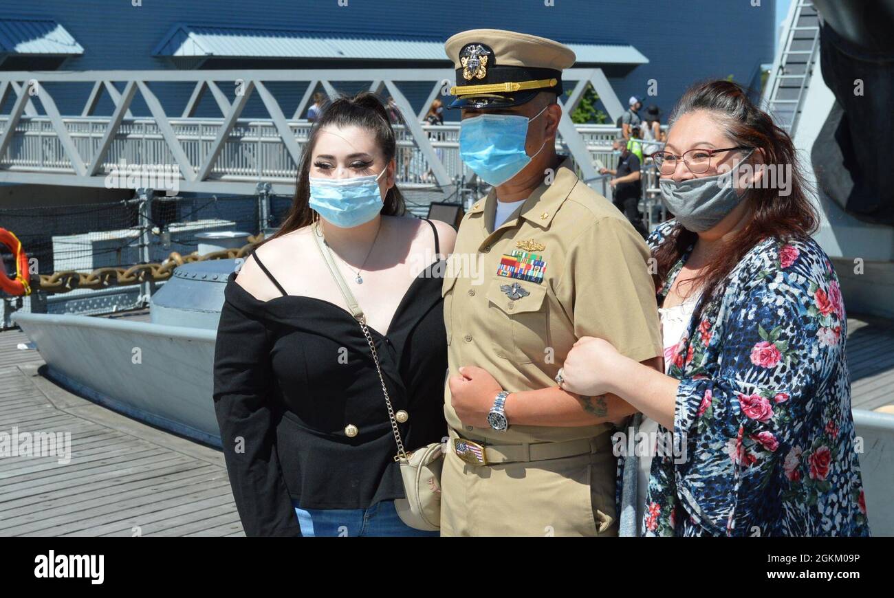 Lieutenant Yau, assigned to USS Whidbey Island (LSD 41) is promoted to ...