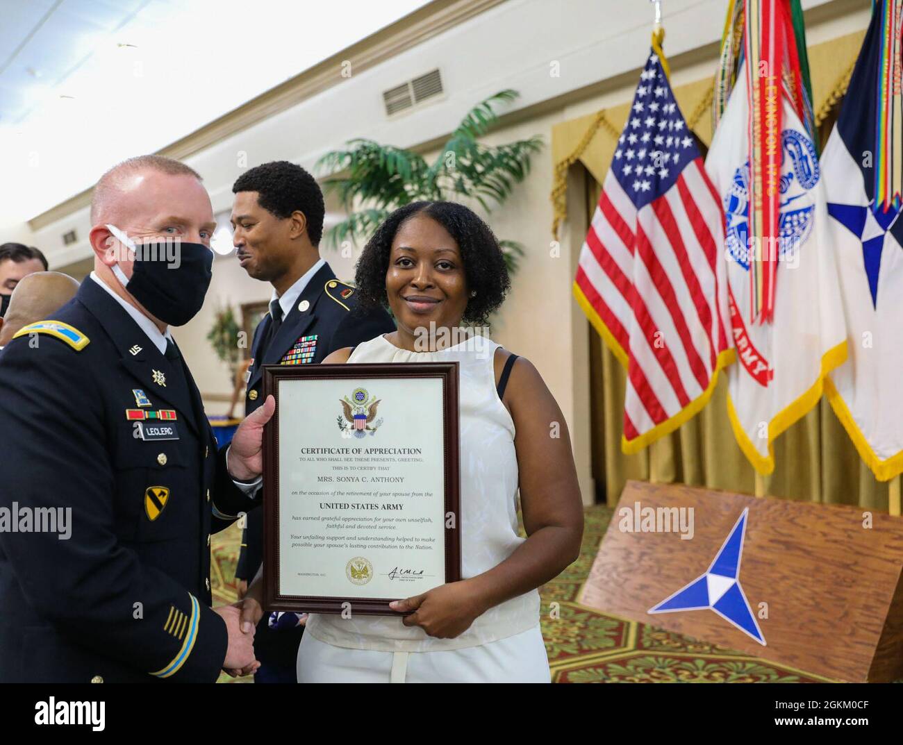Mrs. Sonya Anthony receives a certificate of appreciate of III Armored ...