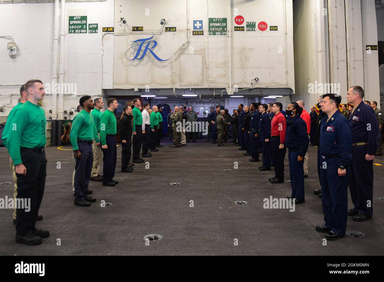 PACIFIC OCEAN (May 21, 2021) – U.S. Sailors stand at attention during a ...