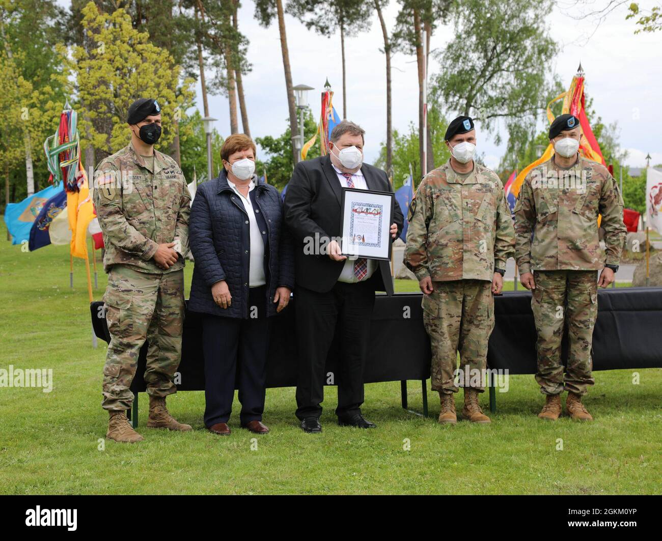 Brig. Gen. Christopher Norrie presents the 7ATC Good Neighbor Award to ...