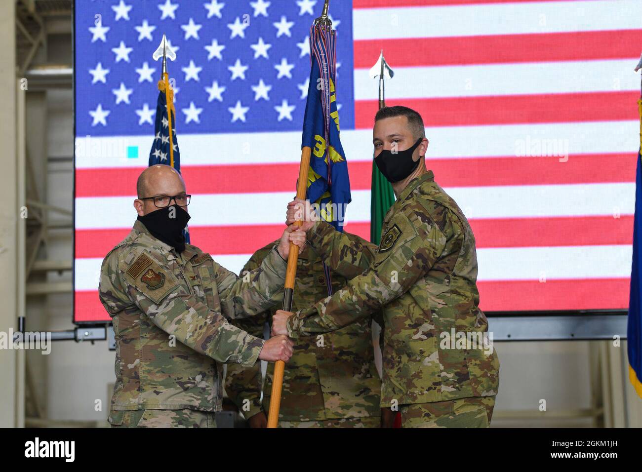 U.S. Air Force Col. Jason M. Mitchell, 31st Maintenance Group commander, passes the guidon to U ...