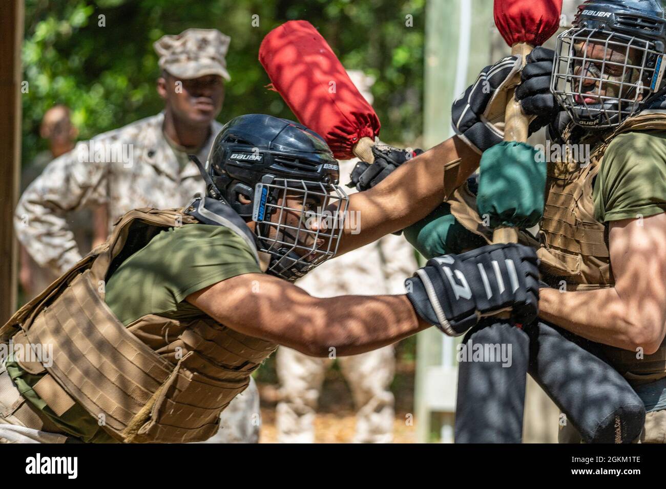 Recruits with Alpha Company, 1st Recruit Training Battalion, participate in pugil sticks and ...