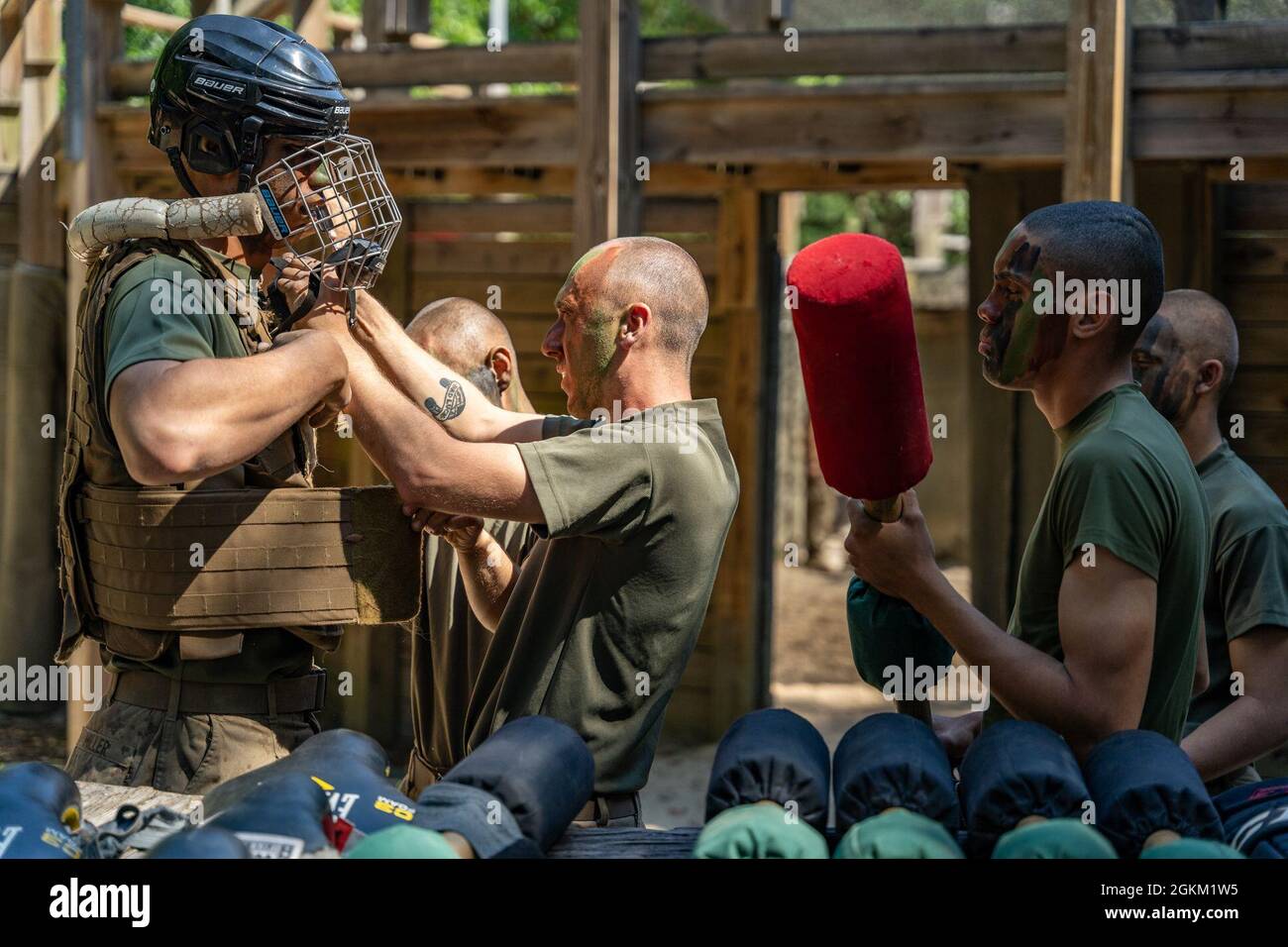 Recruits with Alpha Company, 1st Recruit Training Battalion, participate in pugil sticks and ...