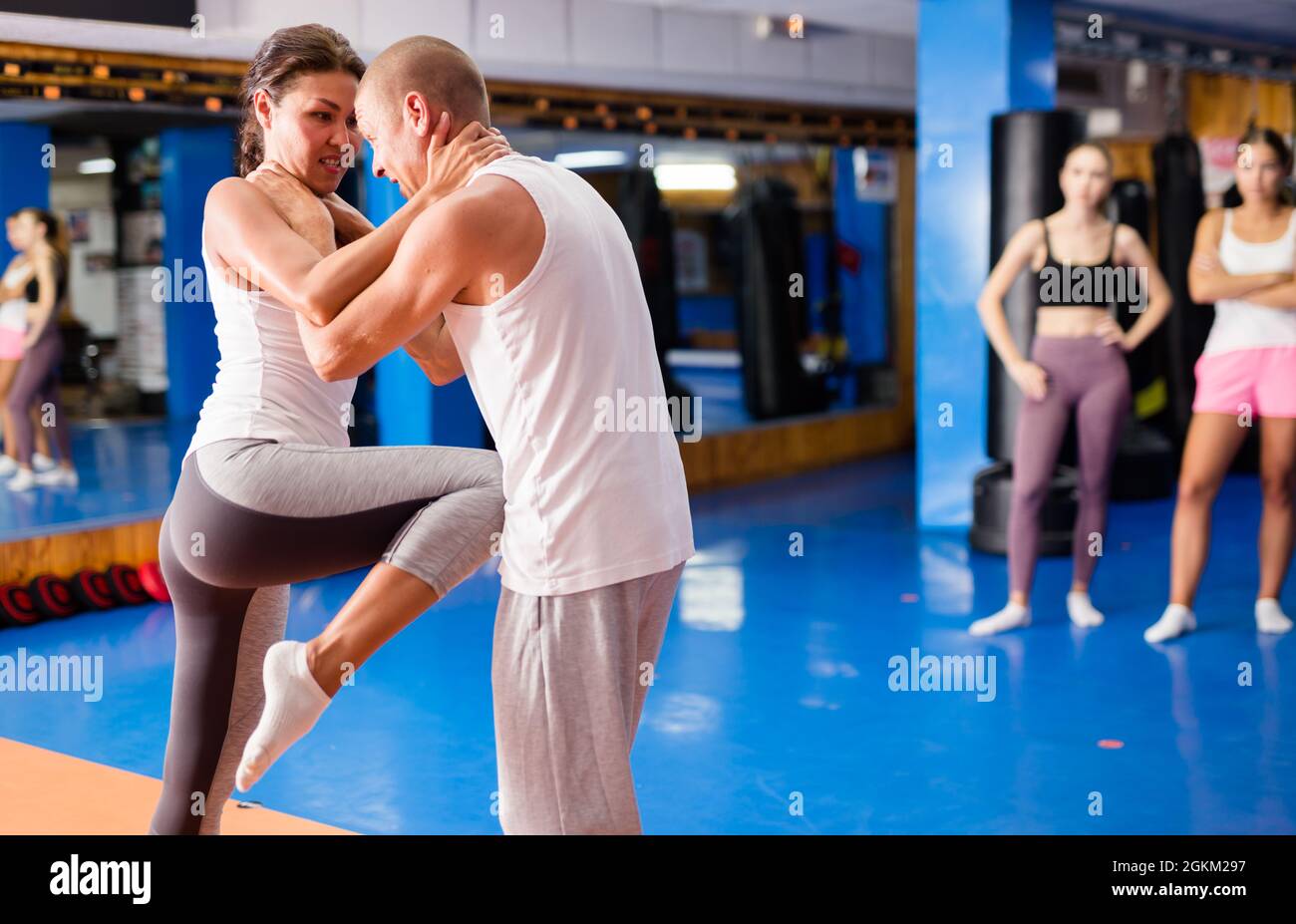 Asian woman practicing self-defence moves with her trainer Stock Photo ...