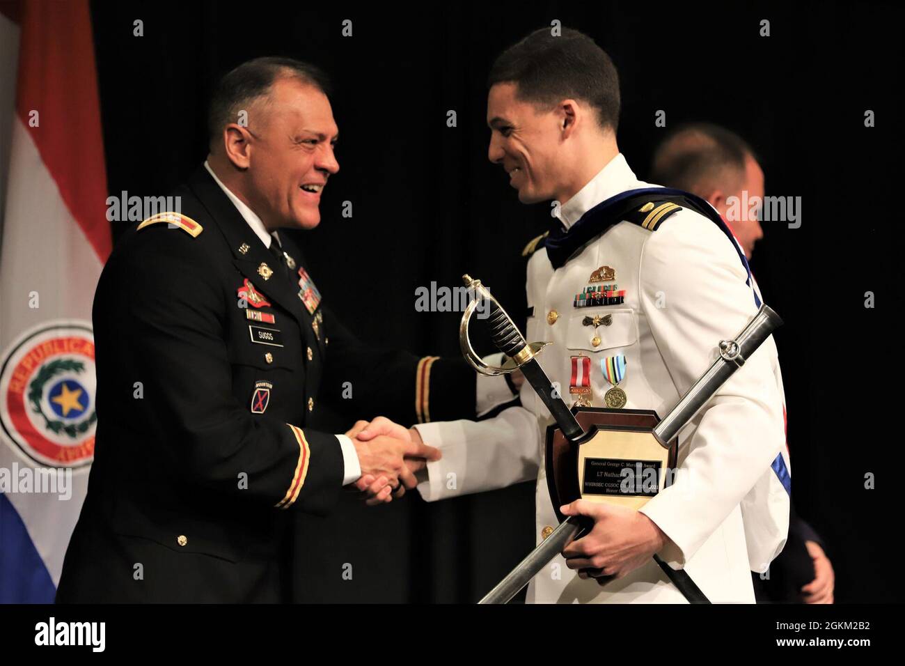 U.S. Coast Guard Lt Nathan M. Borders is congratulated by WHINSEC's ...