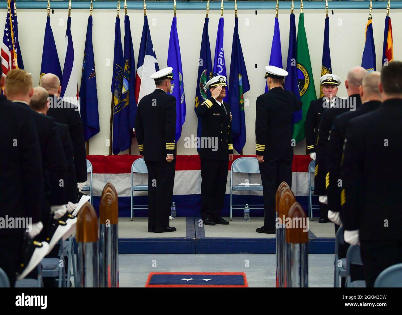 Capt. Gary Montalvo (right) relieves Capt. Lincoln Reifsteck (left) as ...