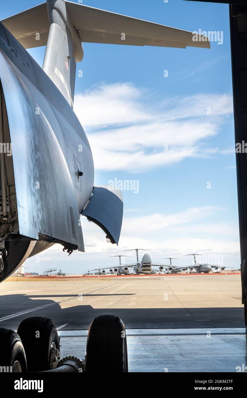 A C-5M Super Galaxy is parked in a hangar for inspection and service ...