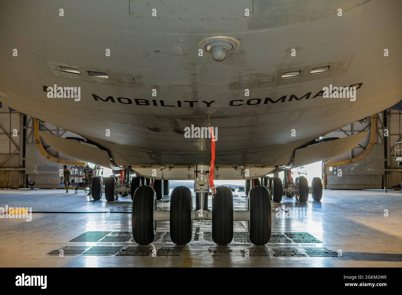A C-5M Super Galaxy is parked in a hangar for inspection and service ...