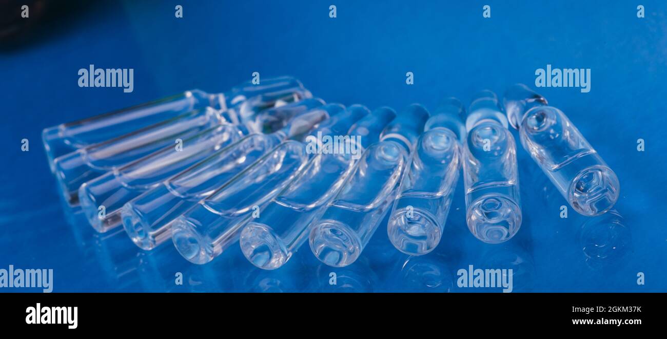 Glass medical ampoule vial for injection. Medicine is liquid sodium ...