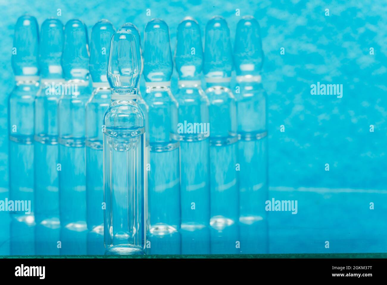 Glass medical ampoule vial for injection. Medicine is liquid sodium ...