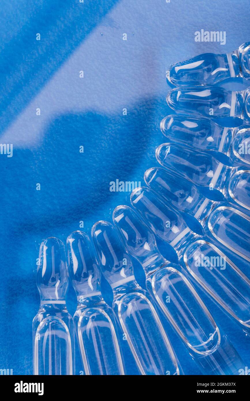 Glass medical ampoule vial for injection. Medicine is liquid sodium ...