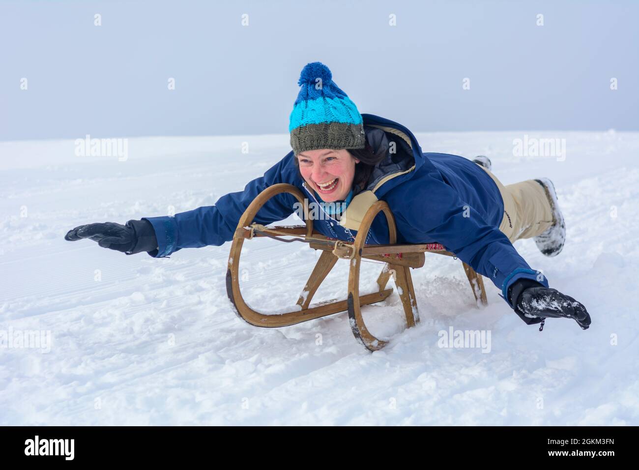 Funny afternoon in wintertime on sleigh slope Stock Photo - Alamy