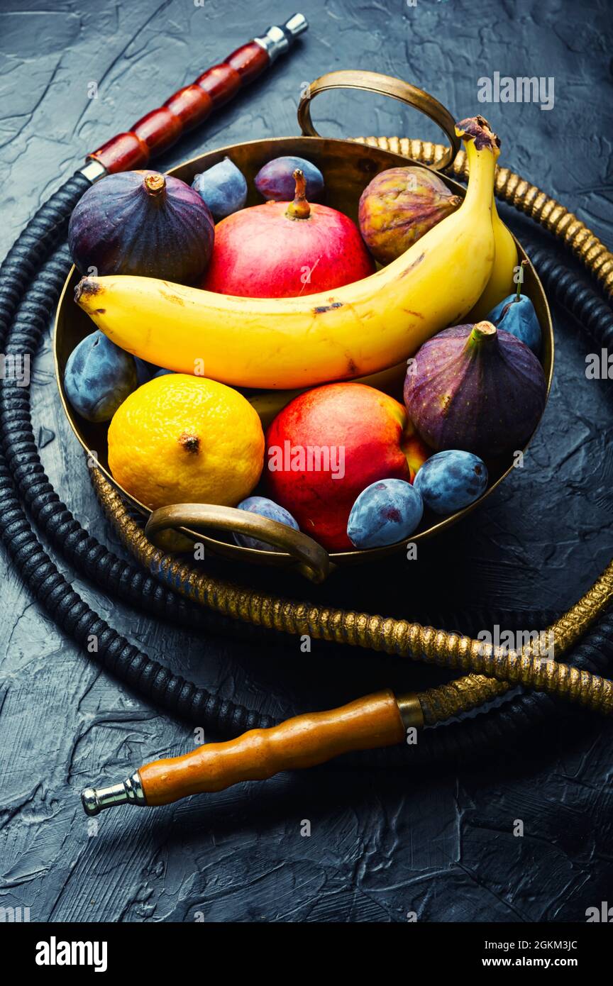 Fresh smoking shisha with fruit.Oriental hookah on fruit tobacco ...