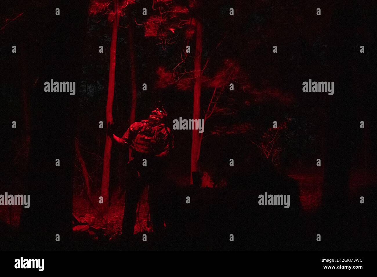 A U.S. Air Force Special Tactics operator guides down a simulated ...