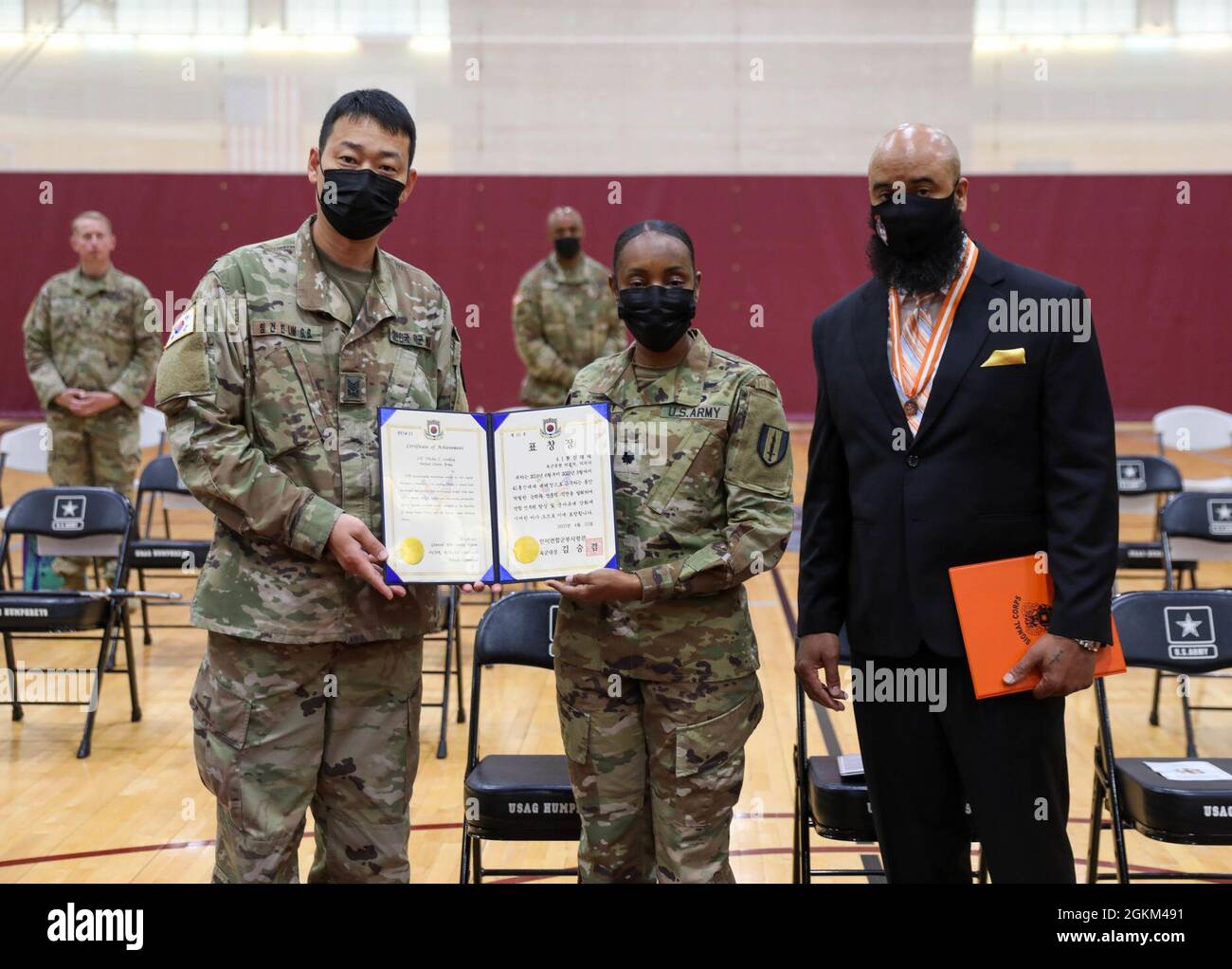 Lt. Col. Lockey, 41st Signal Batallion commander receiving a award from ...