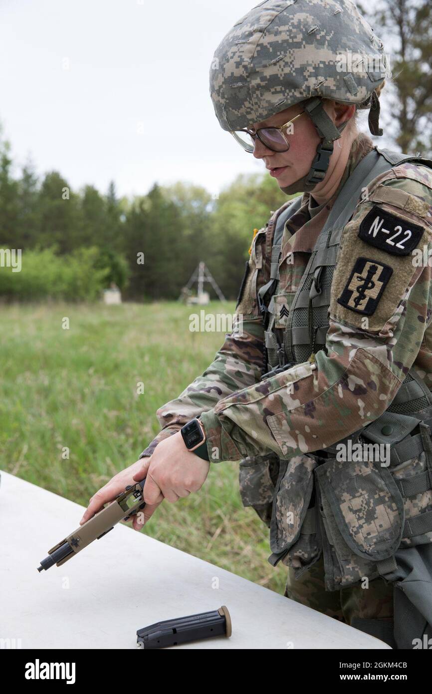Sgt. Jennifer Phillips, a U.S. Army Reserve Soldier, reassembles a M17 ...